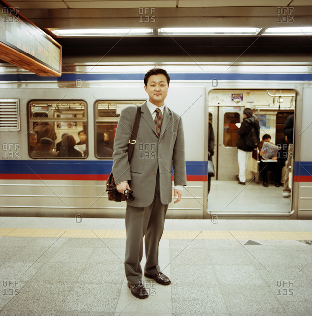 Portrait of businessman on train platform - Stock Image - Everypixel