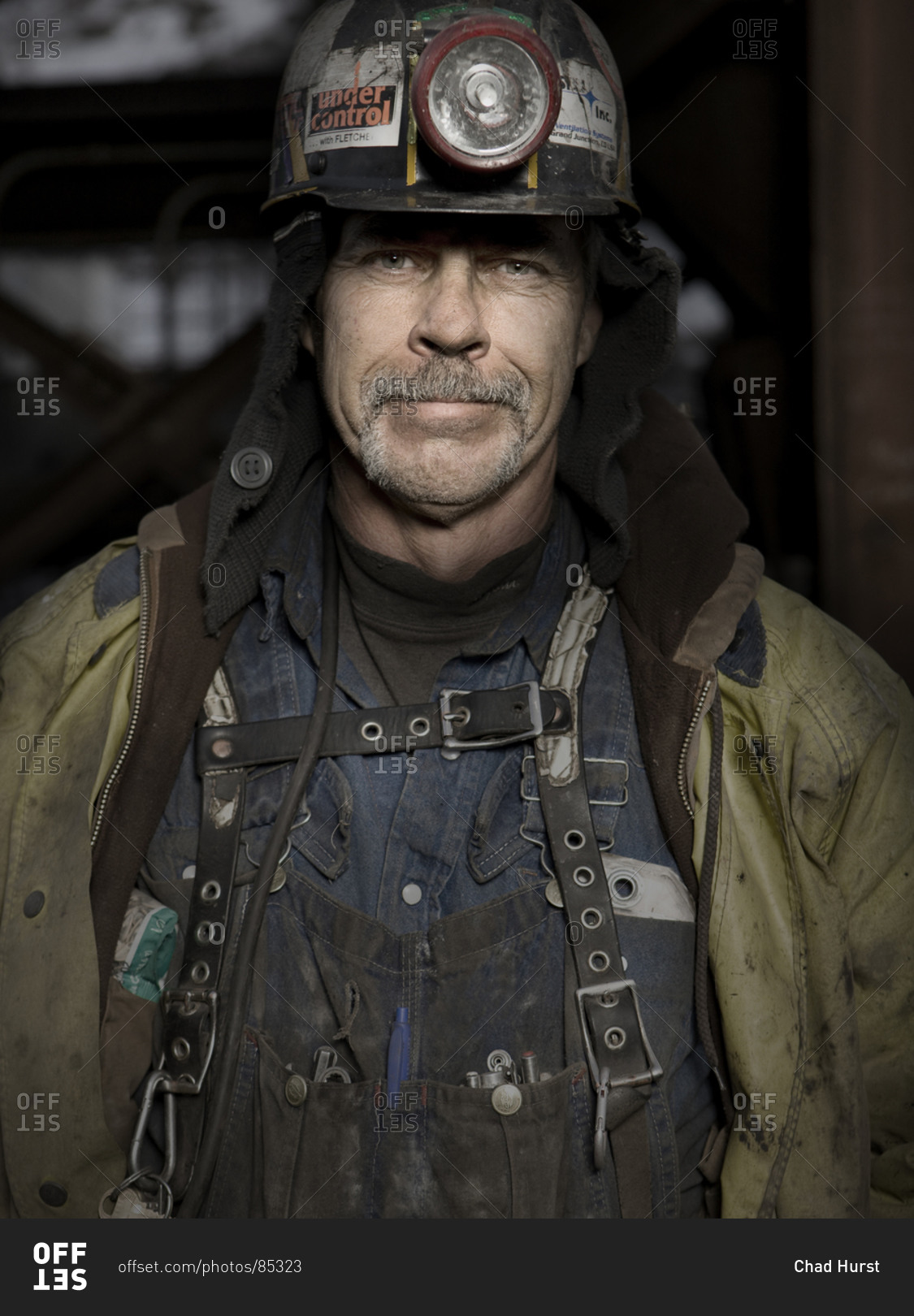 Portrait of a happy coal miner stock photo - OFFSET