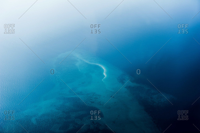 An aerial view of sea currents and a reef in the open ocean - Stock ...