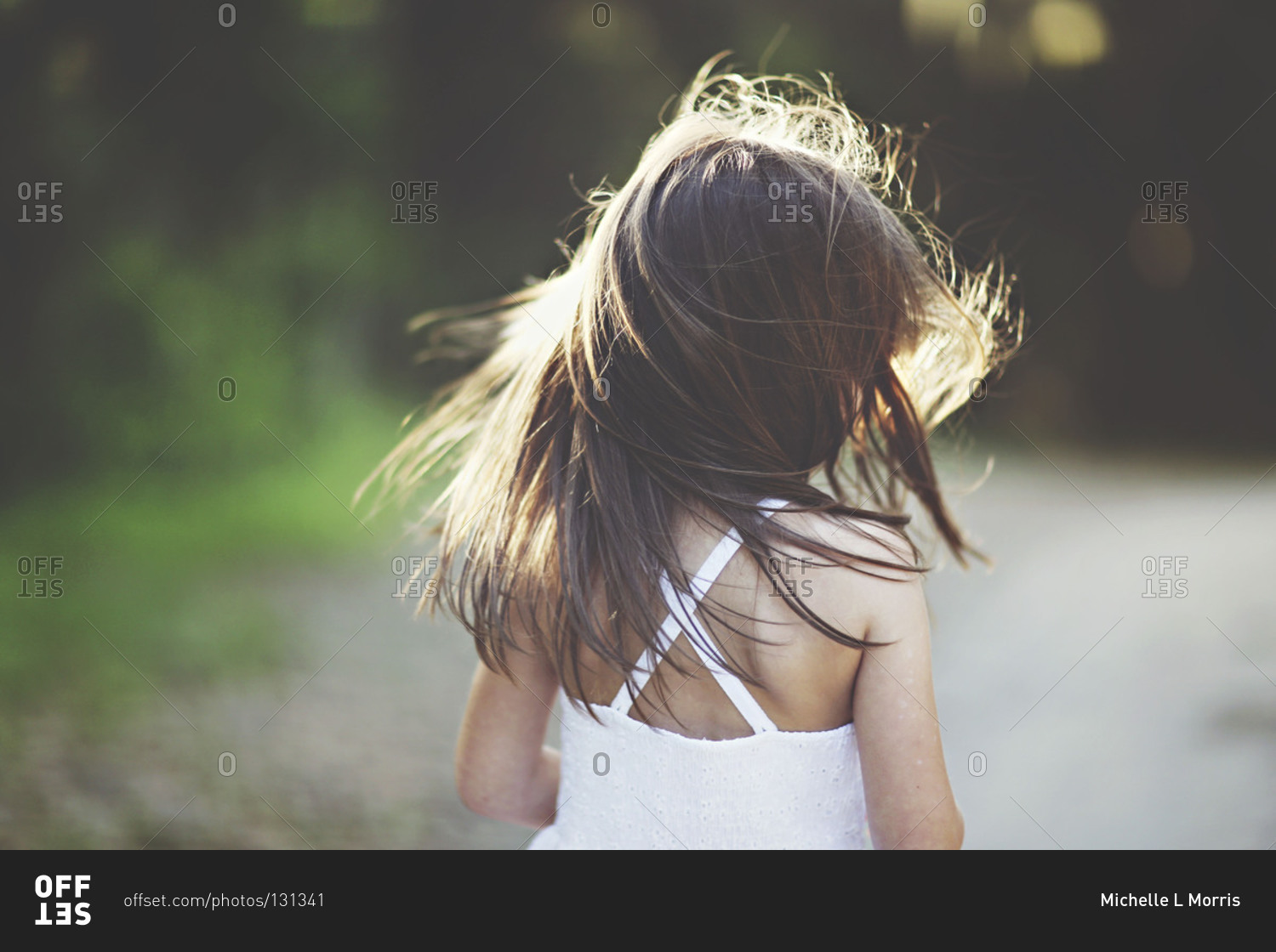Back view of a young girl stock photo - OFFSET