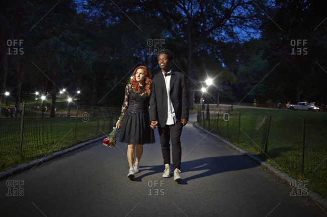 People Walking In Park At Night