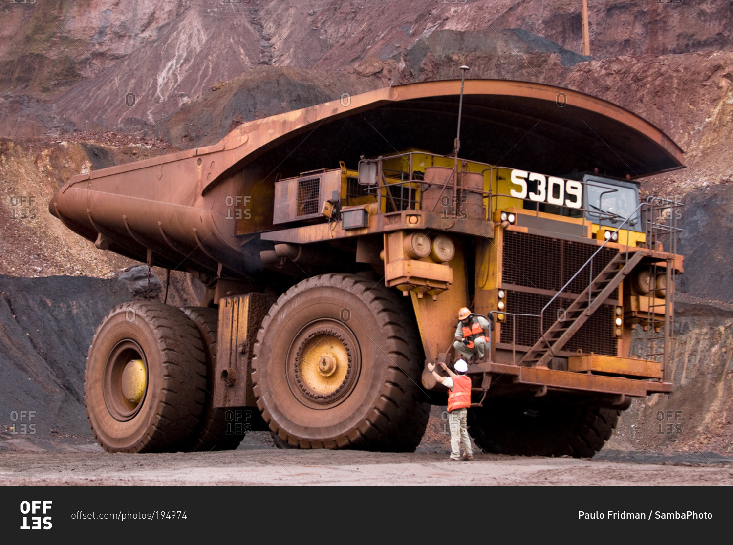 A giant dump truck in a quarry stock photo - OFFSET