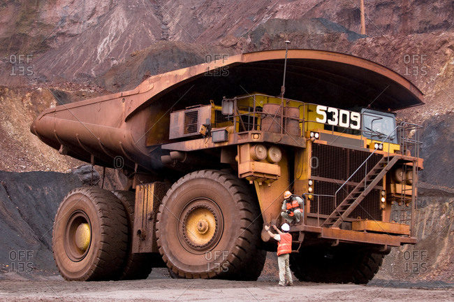 A giant dump truck in a quarry stock photo - OFFSET