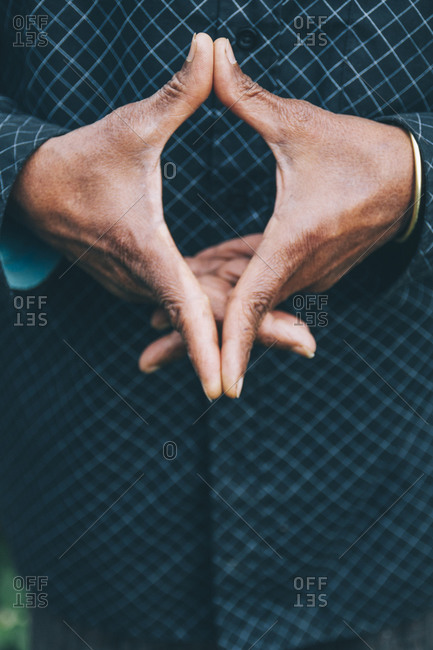 Close up of man's hand in Rasta sign stock photo - OFFSET