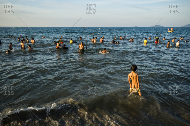 A young boy loses his bathing suit at An Bang beach in Hoi An, Vietnam ...