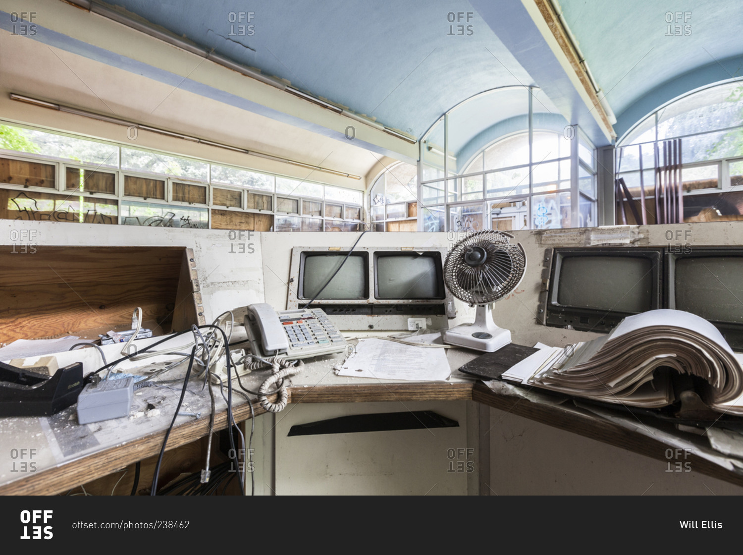 Reception desk of an abandoned insane asylum stock photo - OFFSET