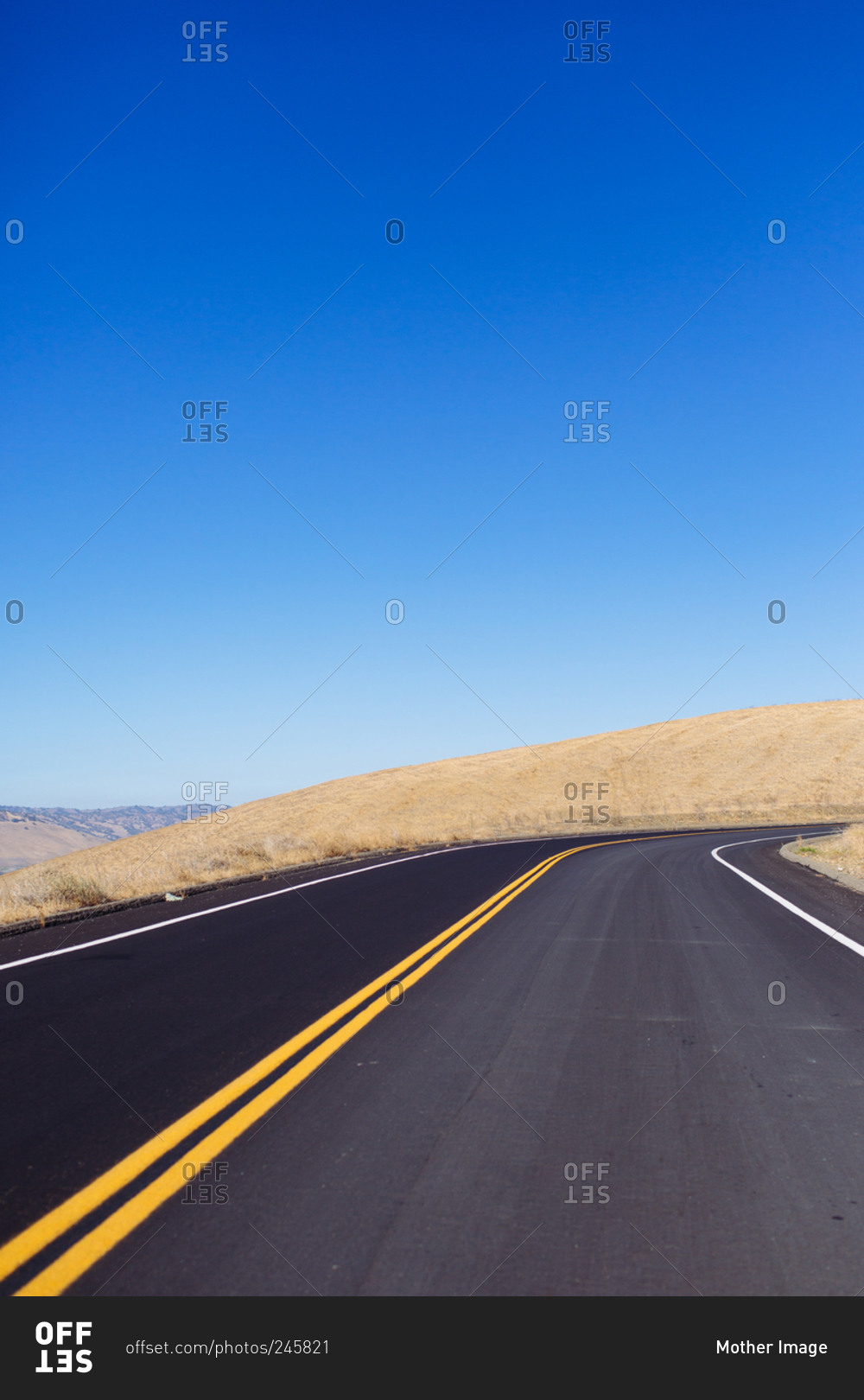 A two-lane road in Northern California stock photo - OFFSET