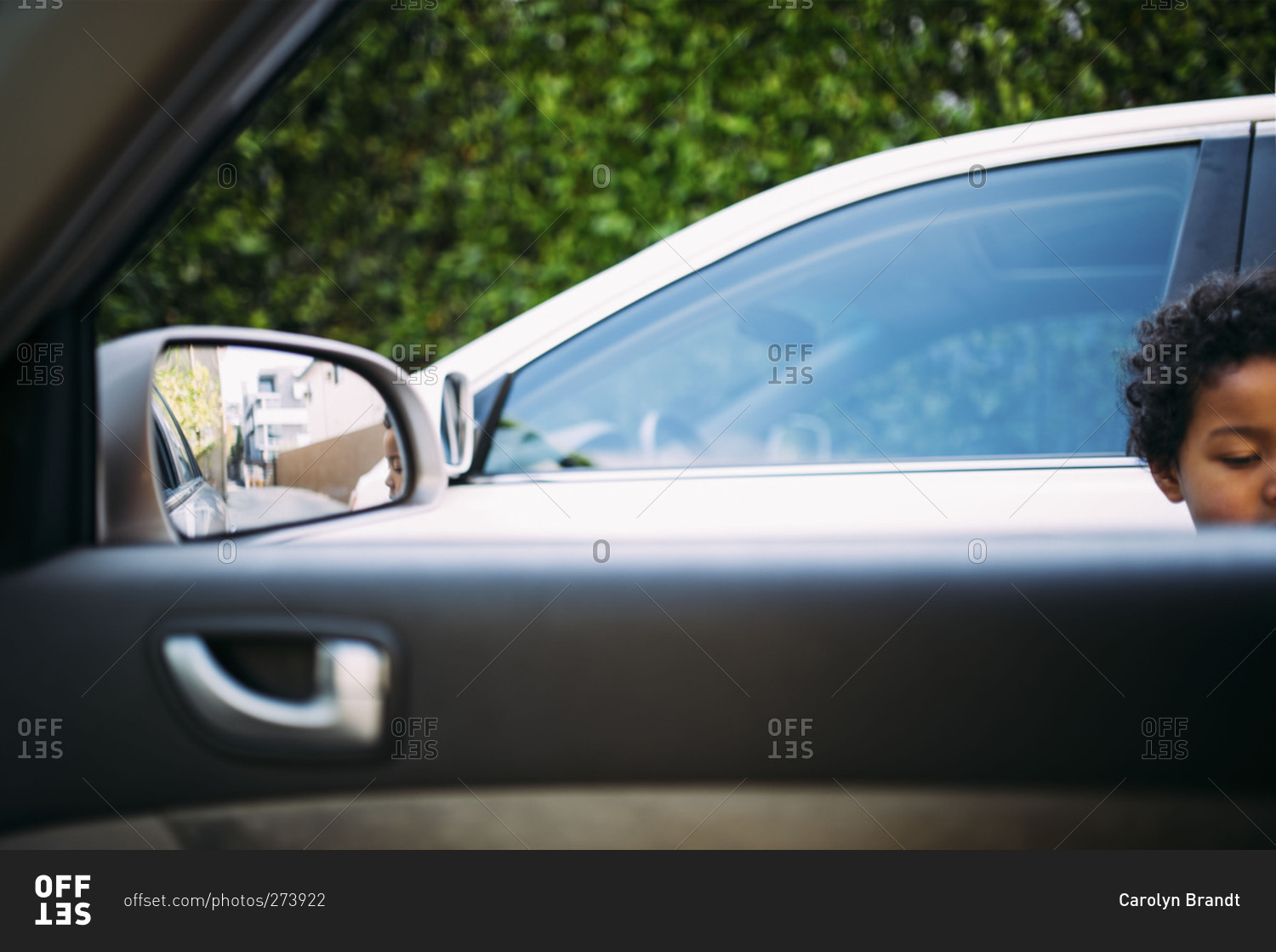 View through car of young child standing outside car window stock photo ...