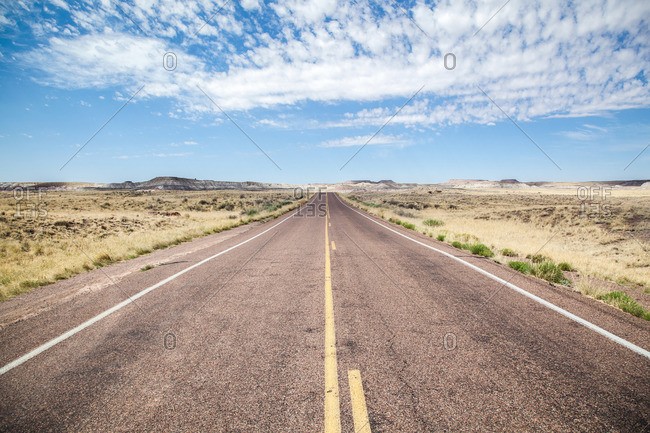 Desert highway disappearing into the distance stock photo - OFFSET Desert highway disappearing into the distance stock photo - OFFSET