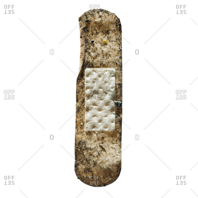 Dirty adhesive bandage stock photo - OFFSET