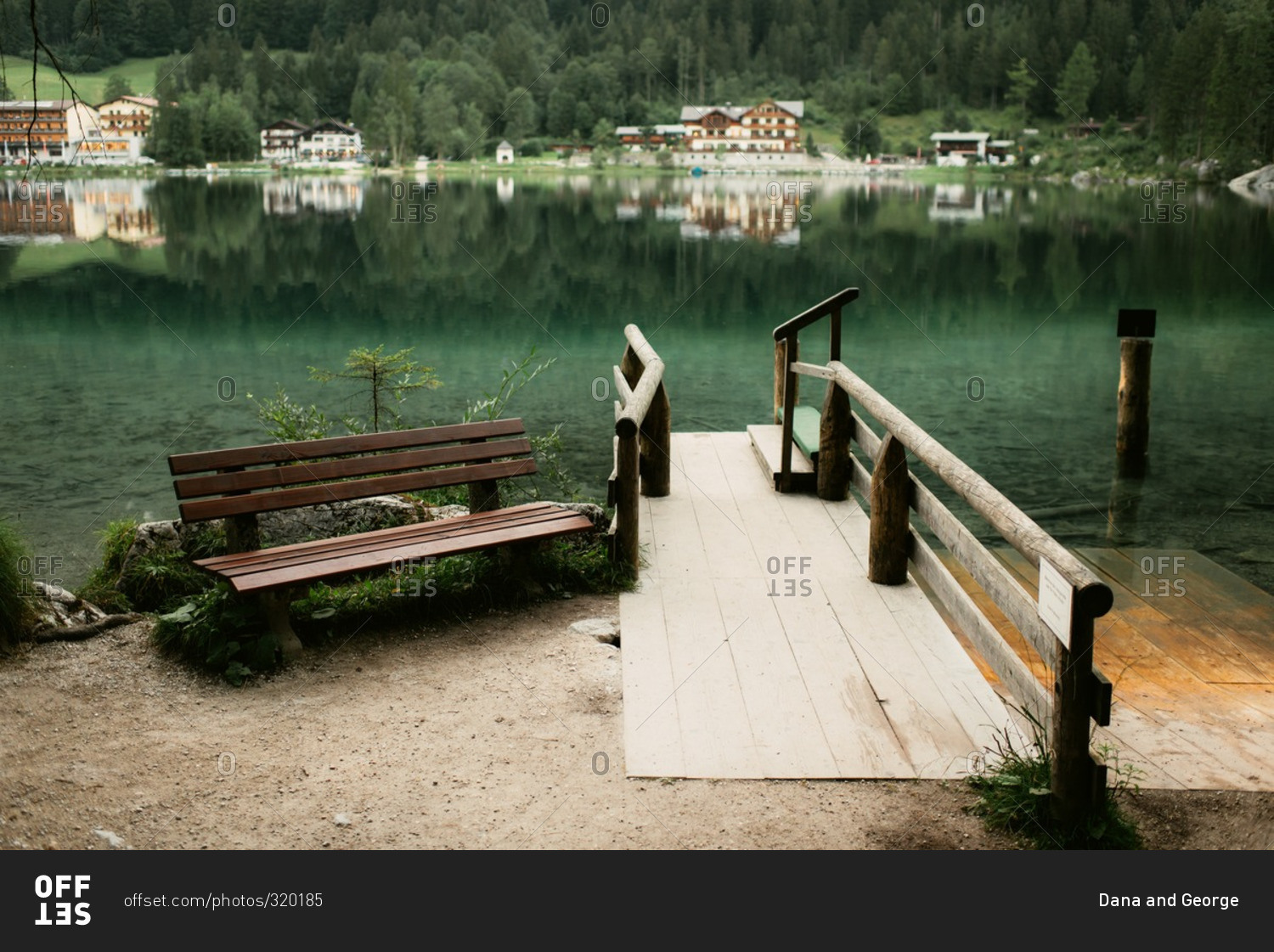 Bench and boat ramp by lake - Stock Image - Everypixel