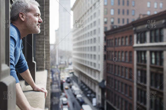 Person Looking Down From A Building