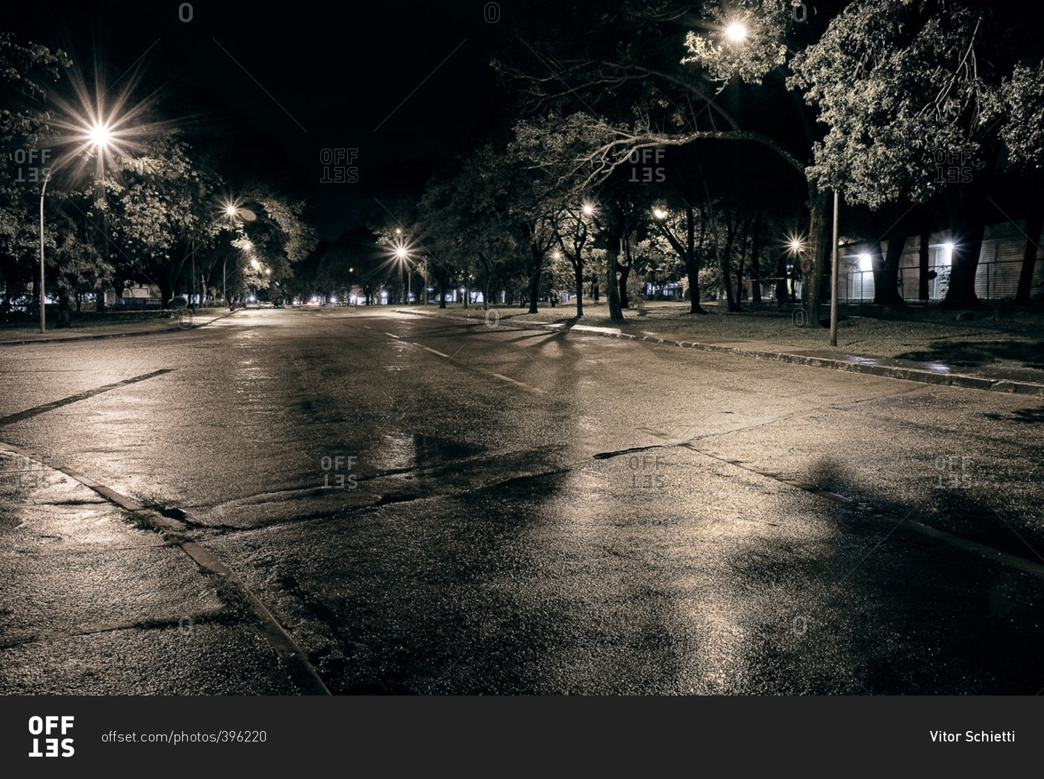 Wet city street at night in Brasilia, Brazil stock photo - OFFSET