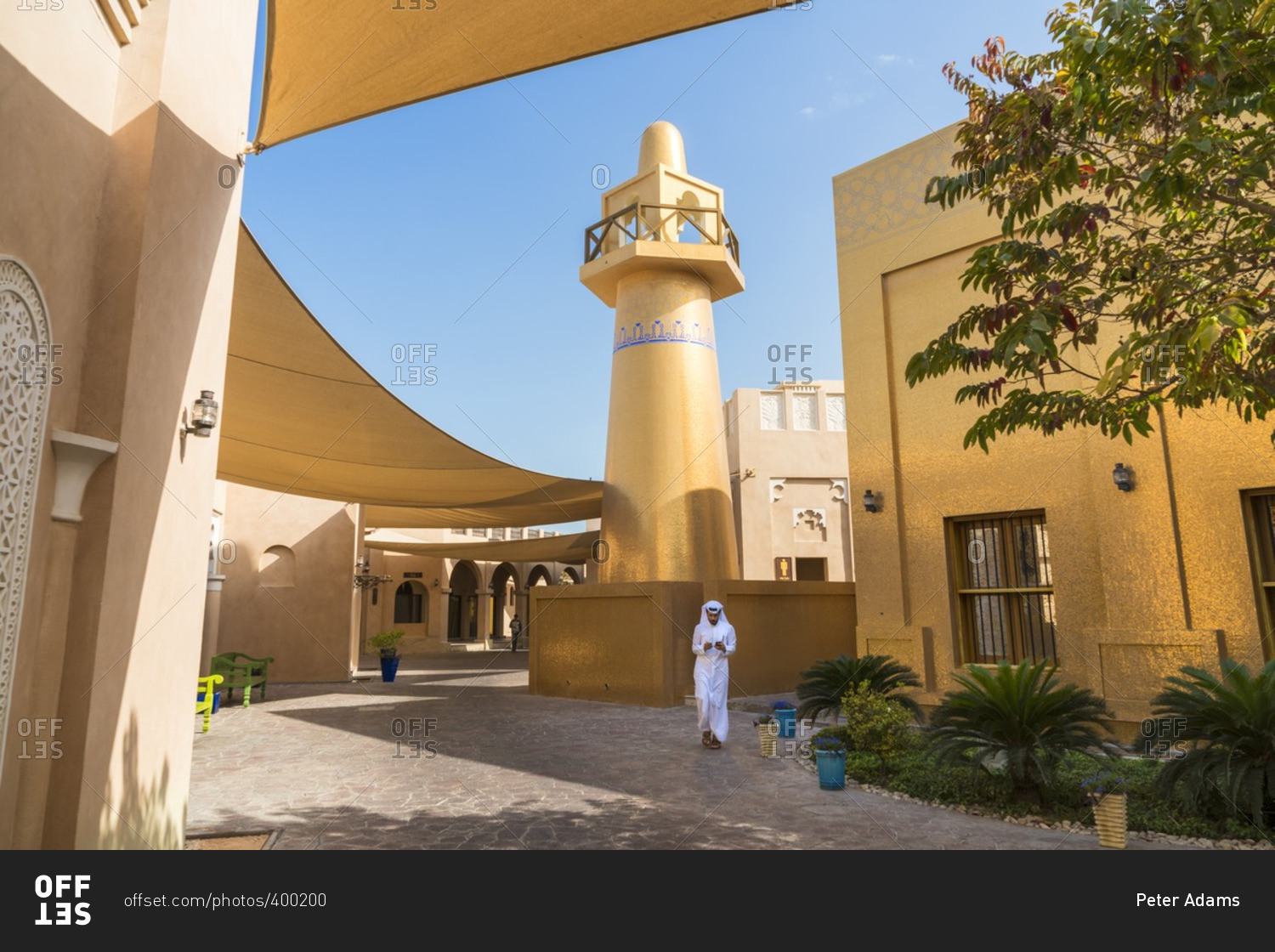 2/8/16: Arab man walking in courtyard at Golden Mosque, Katara Cultural ...