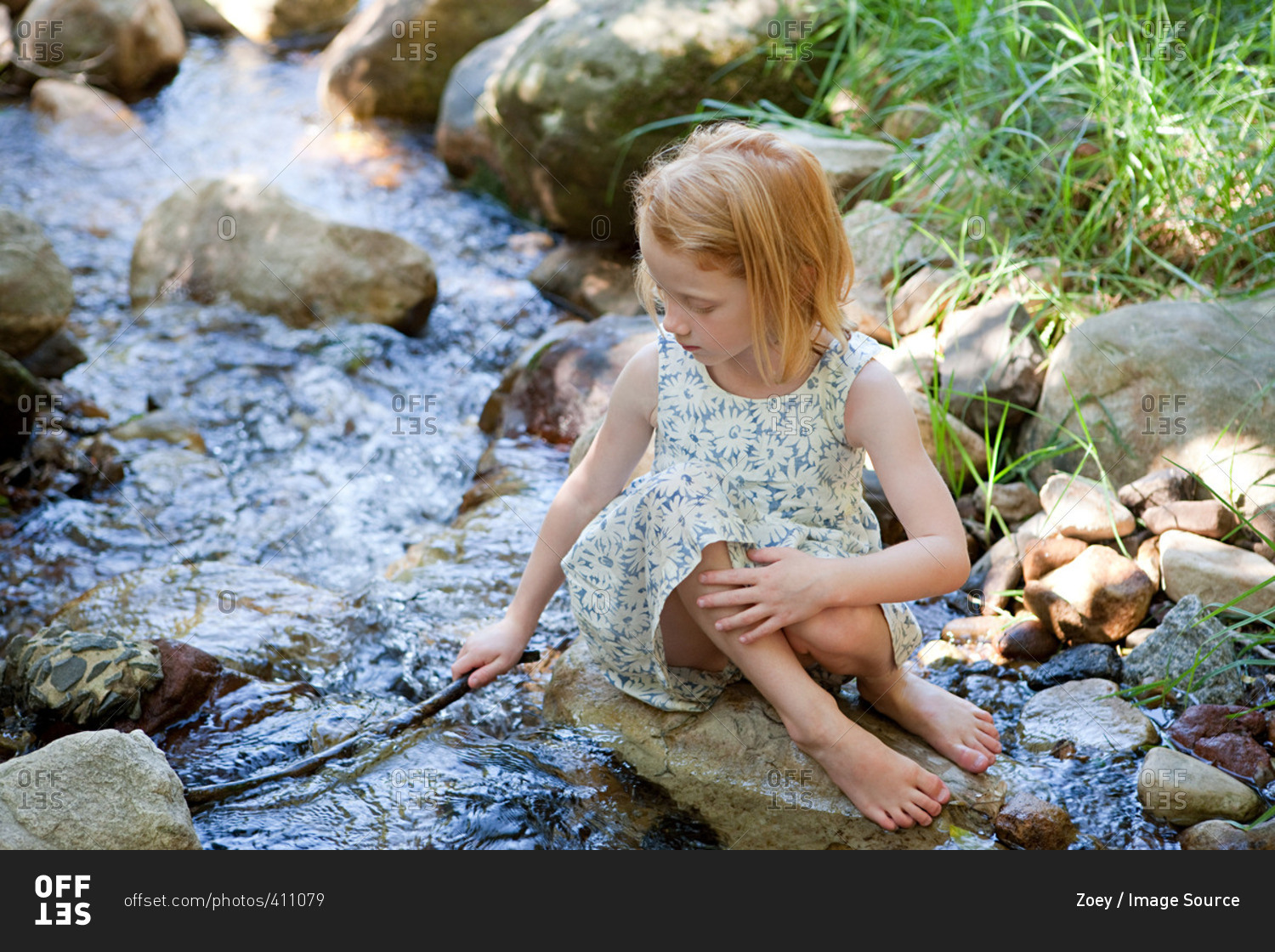 Girl playing in river - Offset stock photo - OFFSET