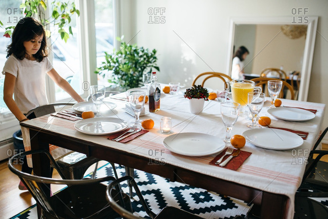 Girl Setting The Table