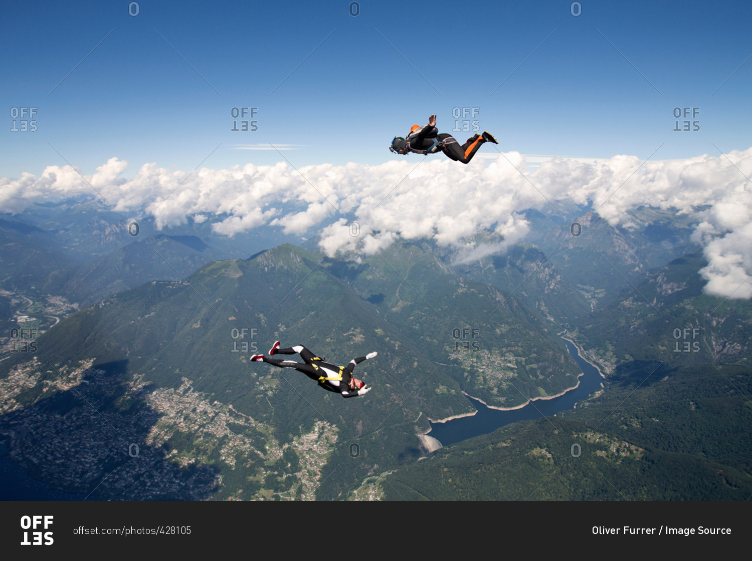 Freestyle skydiving team training together. One man performing air ...