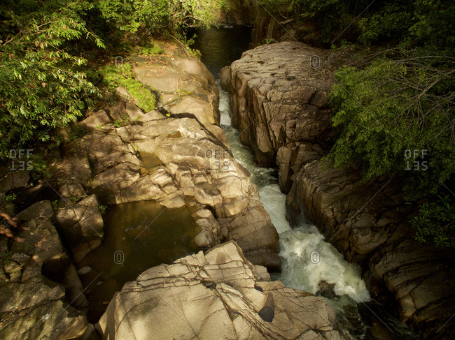 An aerial view of Riam Parit, or Channel Falls, a slot waterfall on the ...