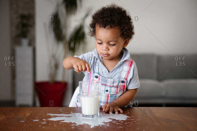 spilled milk kid stock photos - OFFSET