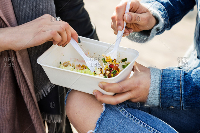 Hands Giving Out Food