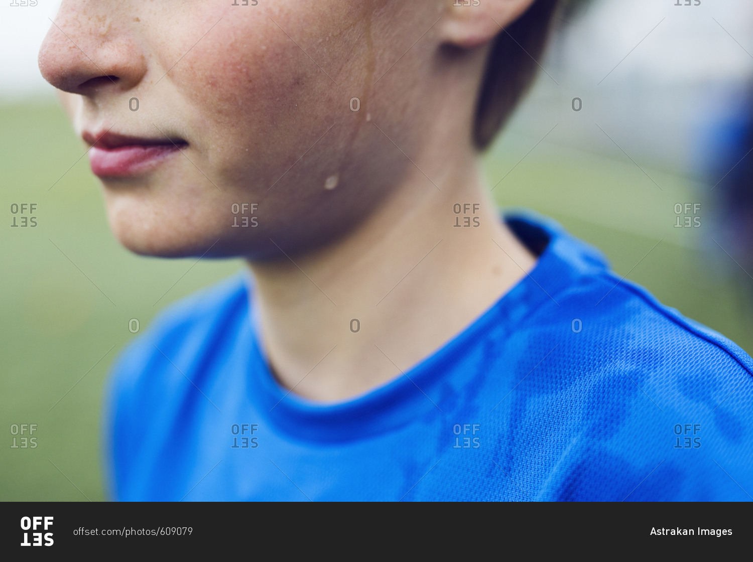 Close-up of boy (12-13) sweating stock photo - OFFSET