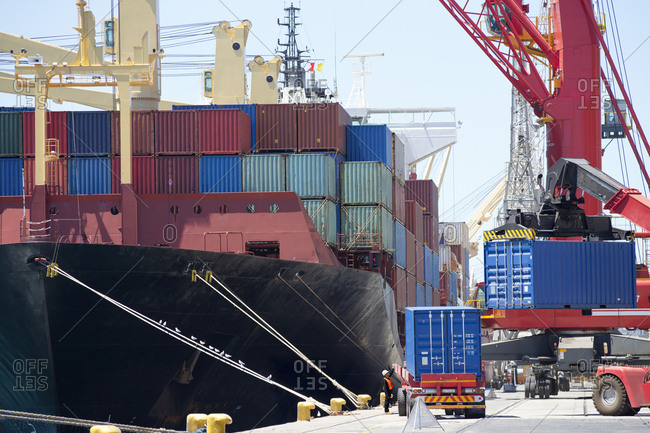 Man Unloading Shipping Container