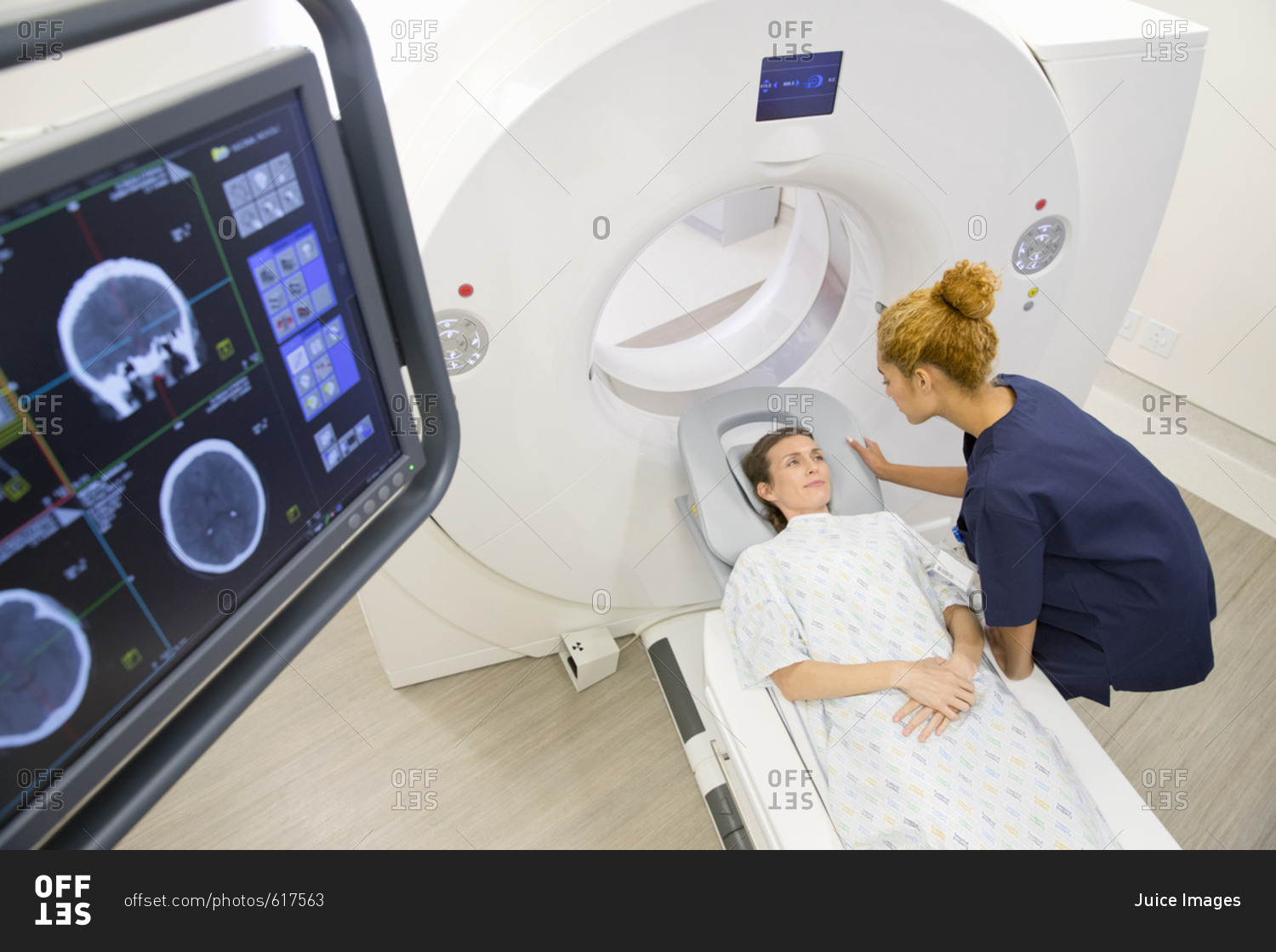 Hospital Radiographer With Female Patient Operating CT Scanner stock ...