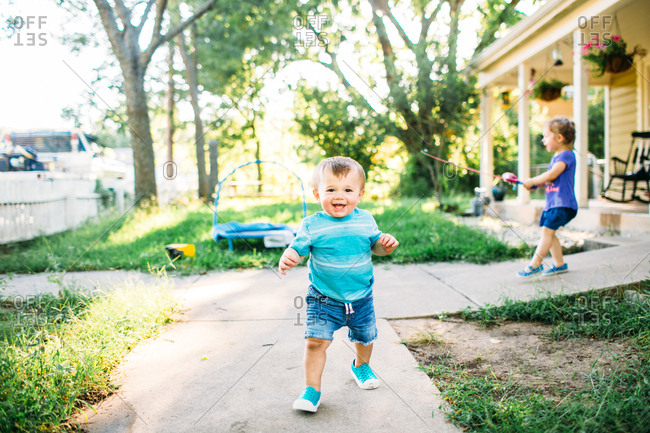 Children playing in front yard stock photo - OFFSET Children playing in front yard stock photo - OFFSET