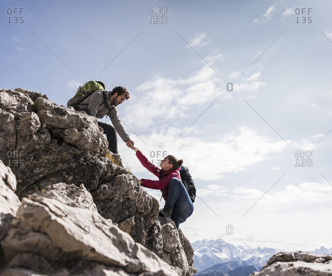 Helping Someone Up A Mountain
