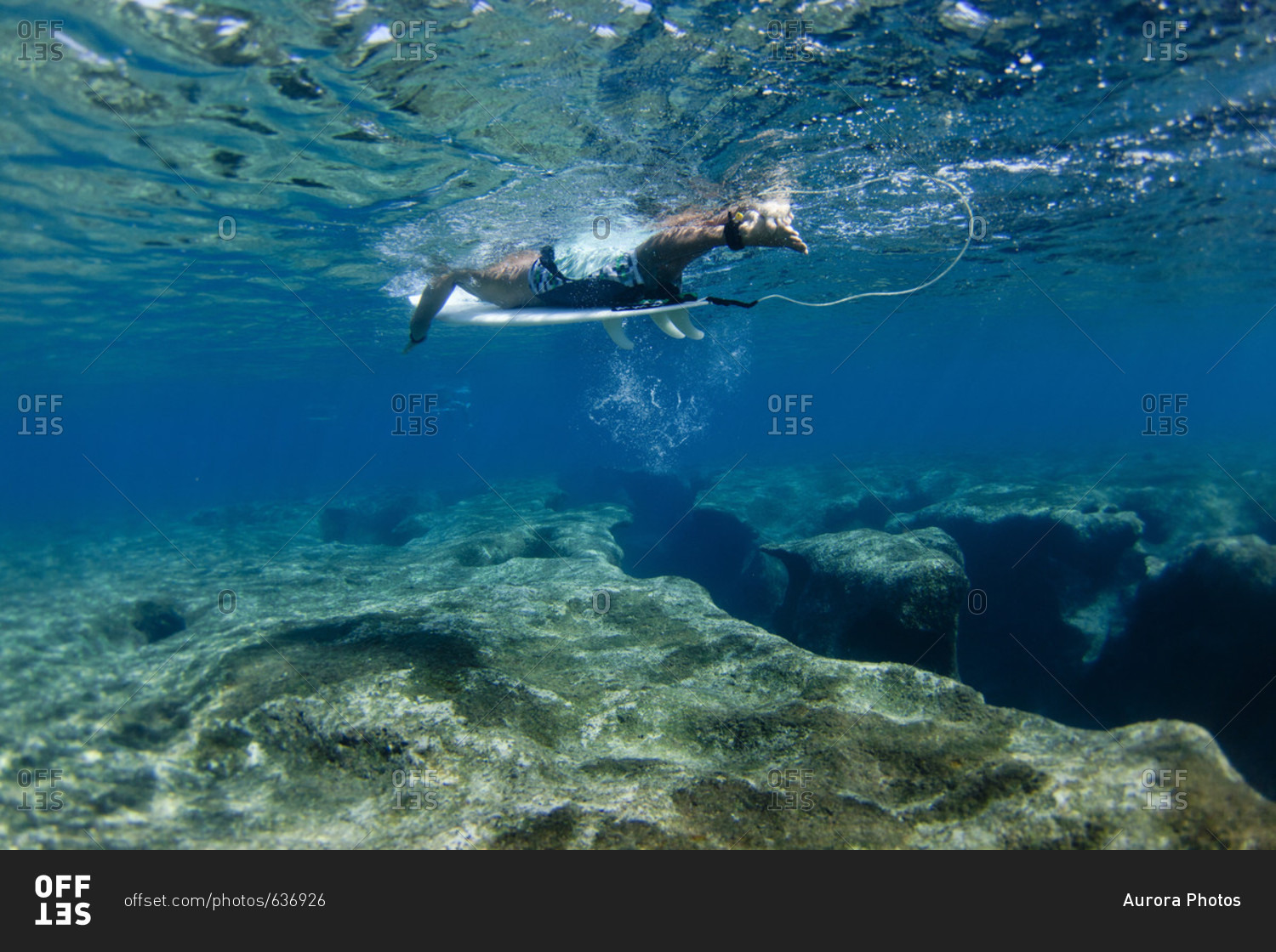 Underwater view of surfer above reef at Pipeline, on North Shore of ...