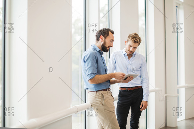 Two Men Standing And Talking