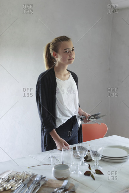 Girl Setting The Table