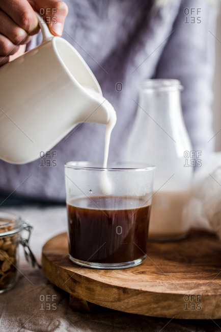 Pouring Cream Into Coffee