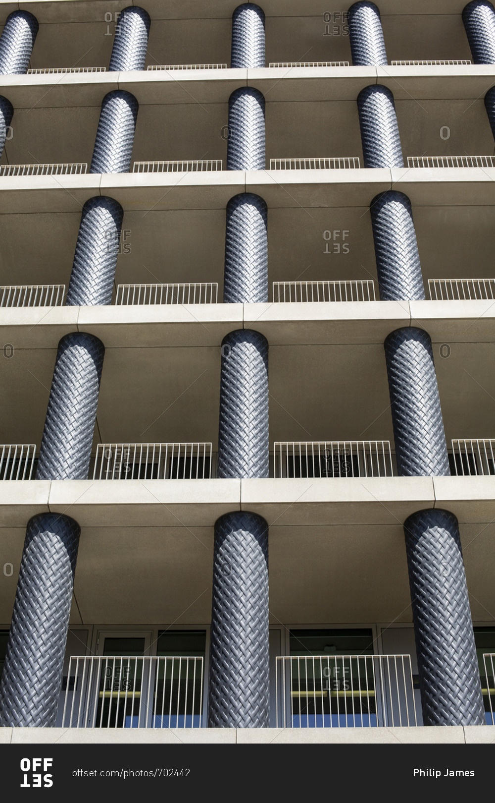 Exterior view of modern building with columns stock photo - OFFSET
