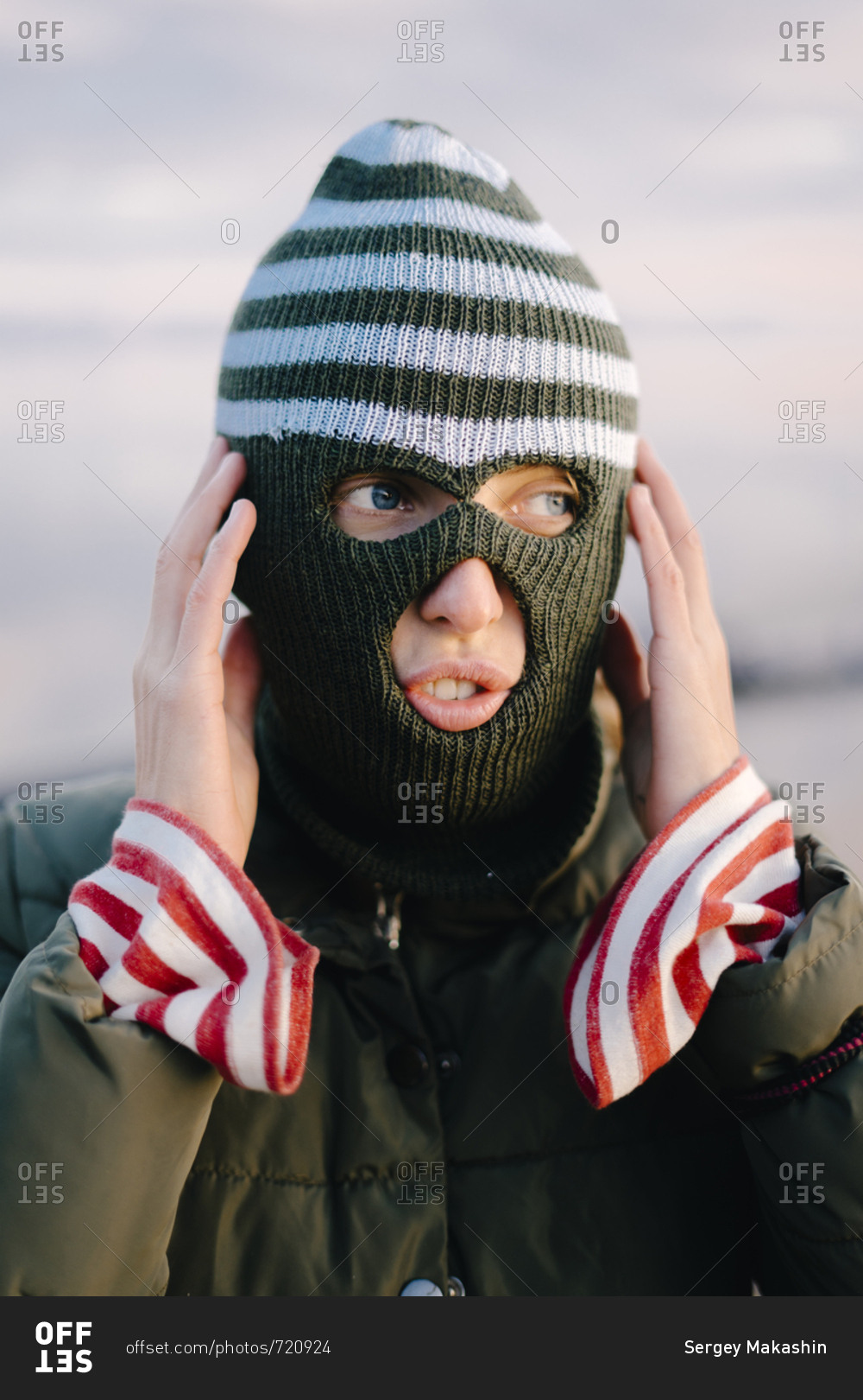 Close Up Of Woman Wearing Ski Mask On Shore Of Lake Baikal Region In