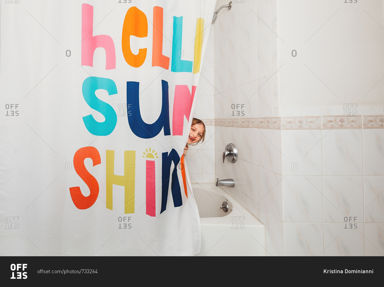 Happy girl peaking out from behind a shower curtain stock photo - OFFSET Happy girl peaking out from behind a shower curtain stock photo - OFFSET