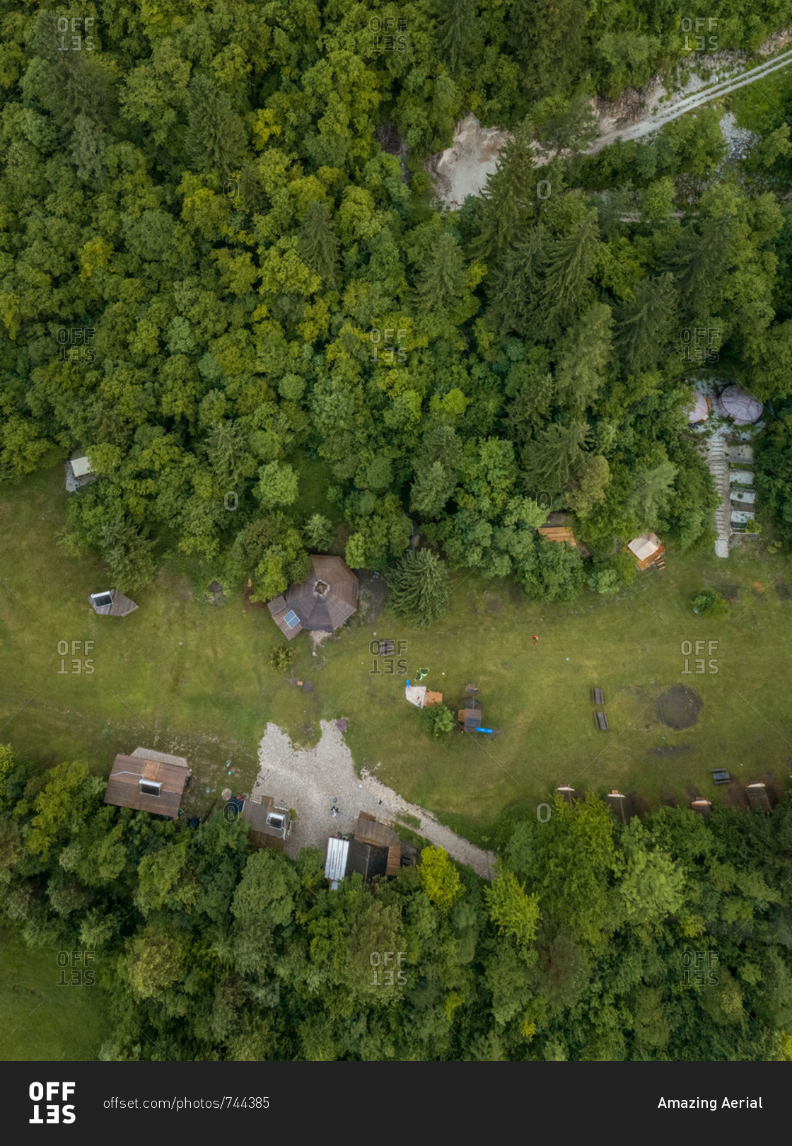 Aerial view of a summer camp with tents located in a valley near the ...