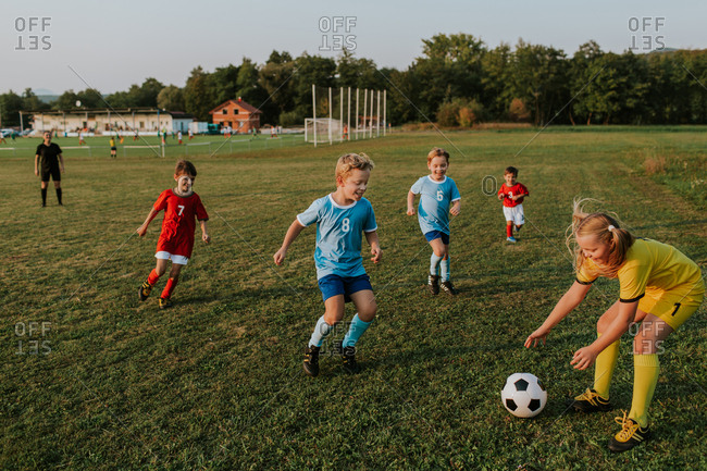 Footballer Chasing The Ball