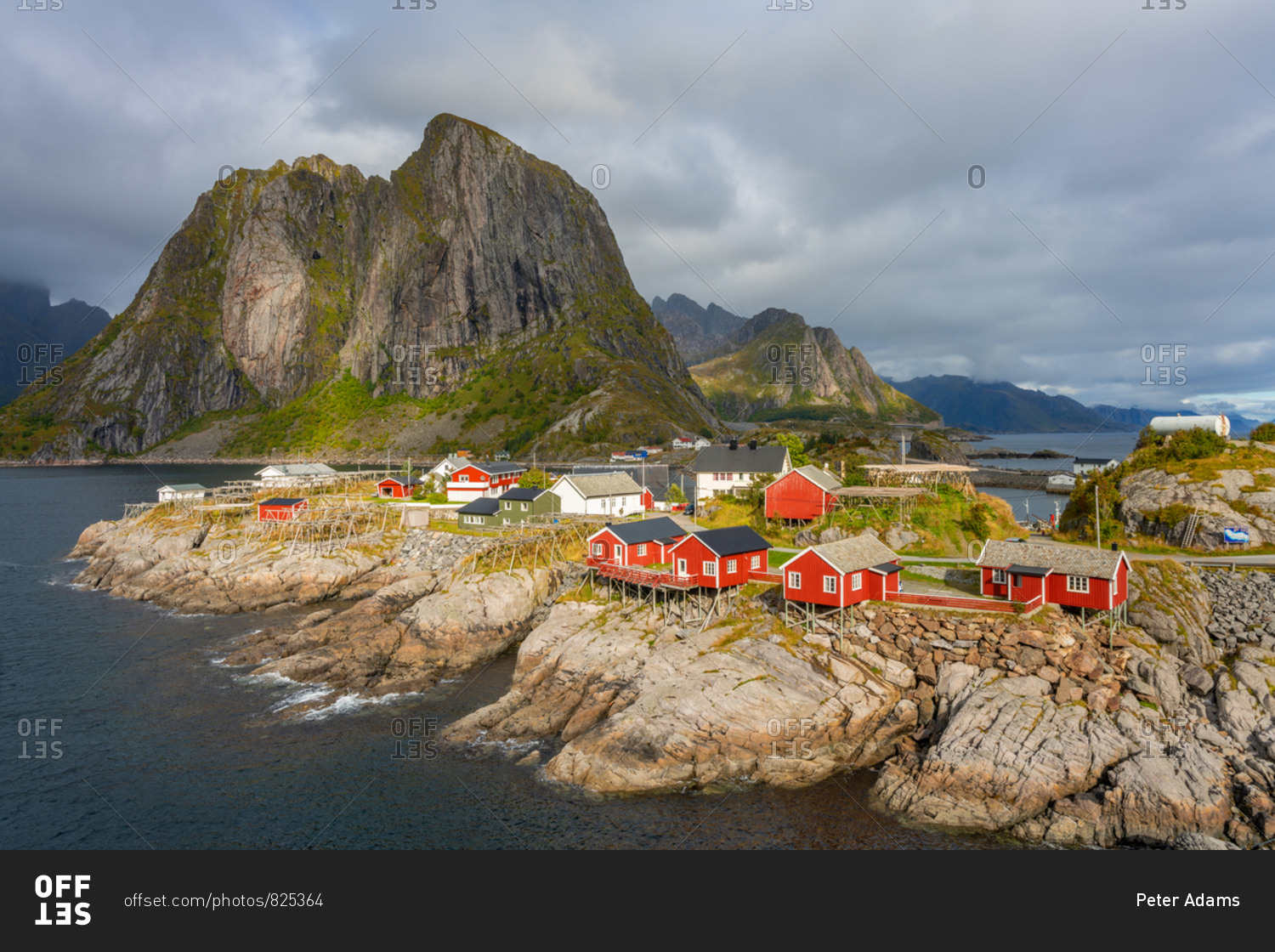 Red wooden huts, known as Rorbu, in the village of Reine on the Hamnoy ...