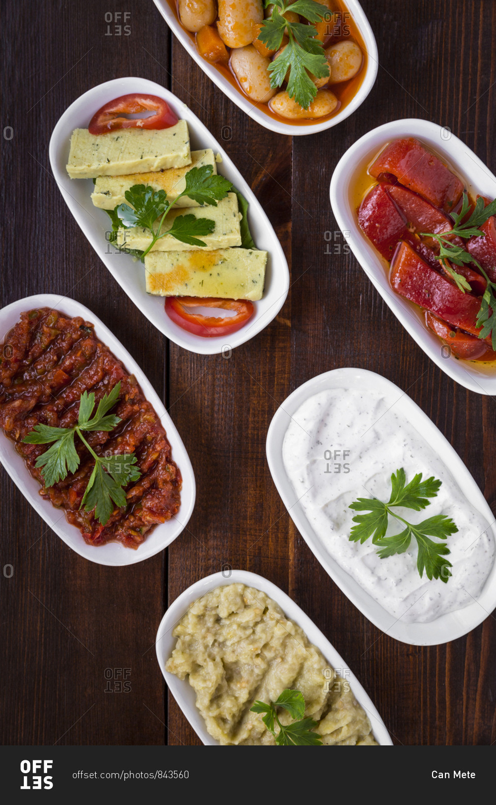 Traditional Turkish mezes on the wooden surface stock photo - OFFSET
