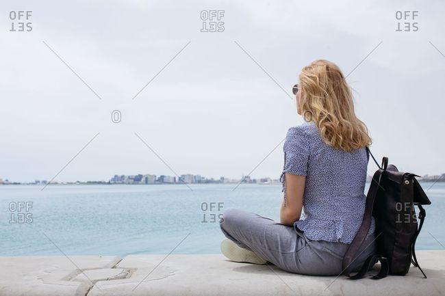Girl Sitting Cross Legged Back View