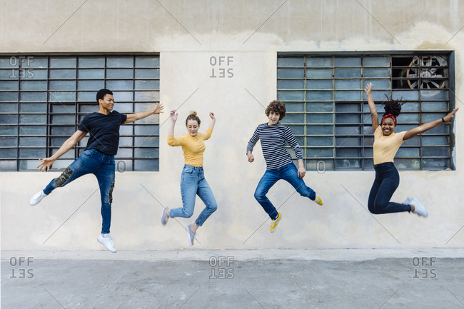 Friends Jumping In Air