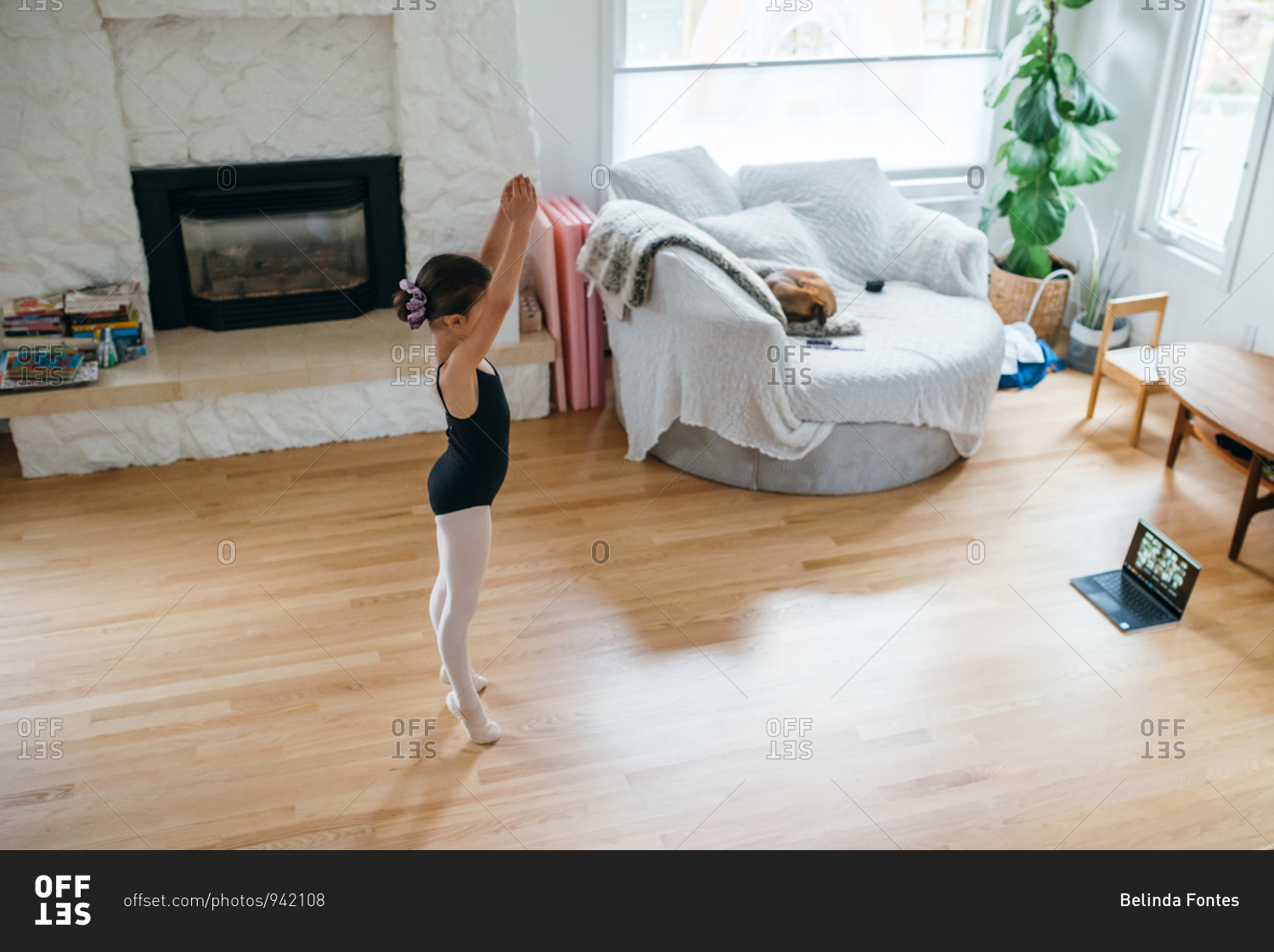 Girl practicing ballet at home stock photo - OFFSET