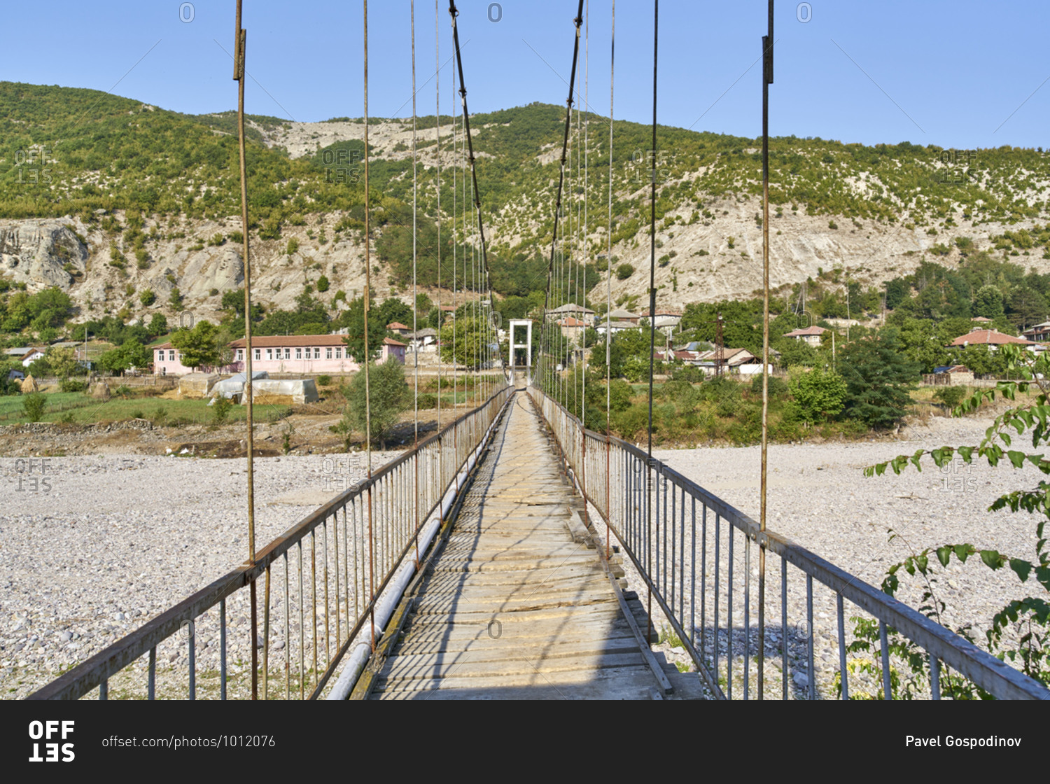Rope bridge over the river Borovitsa leading to the village of Nenkovo ...