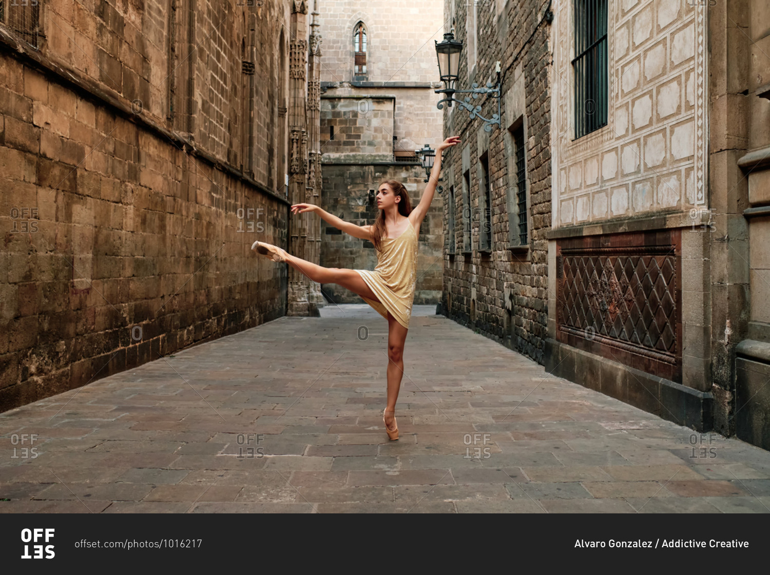 Full body of talented young female ballet dancer in dress and pointe ...