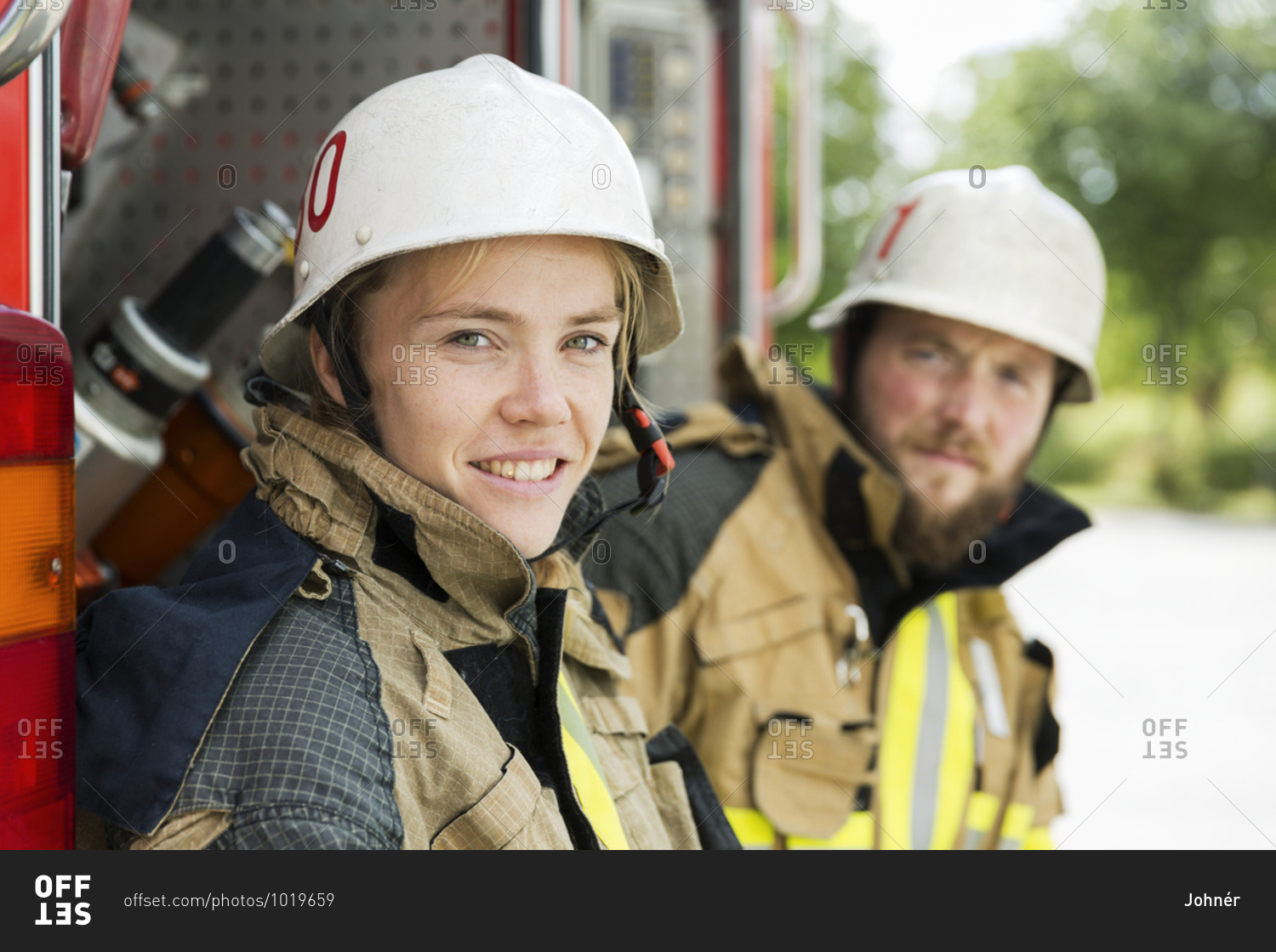 Firefighters in front of fire truck - Stock Image - Everypixel