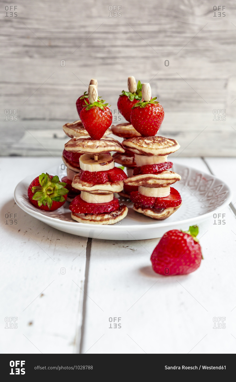 Plate of mini pancakes with strawberries and bananas - Stock Image ...