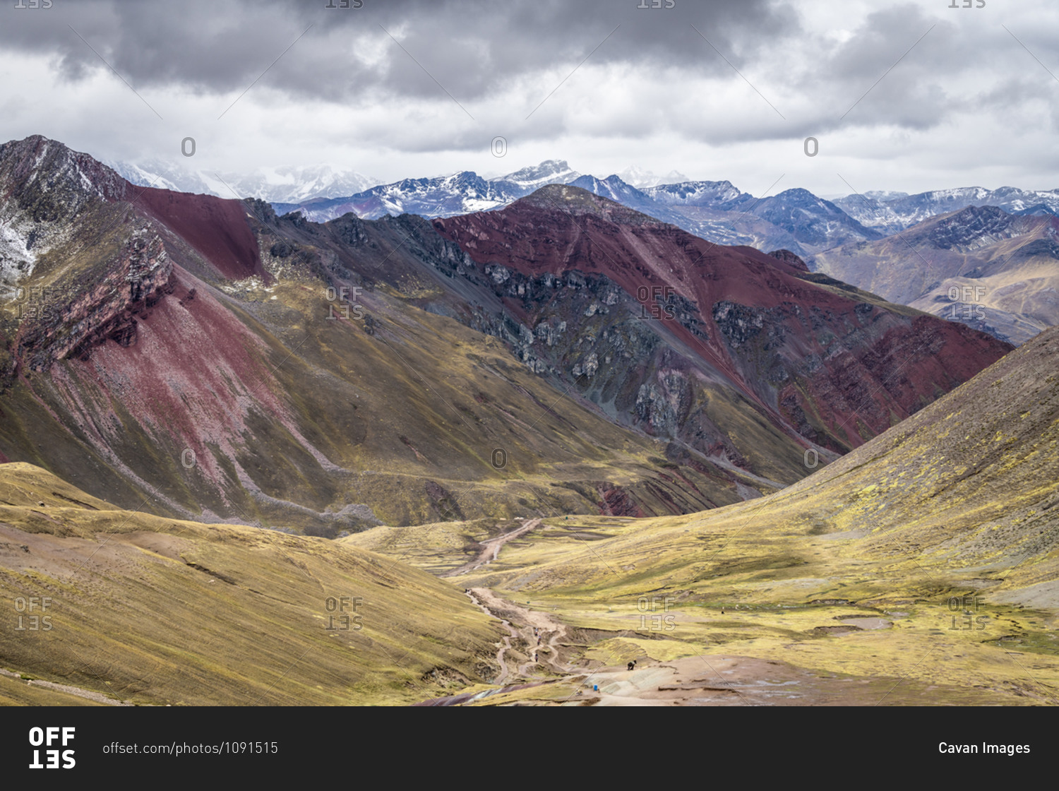 Scenic view of valley amongst high andes mountains on rainbow mountain ...