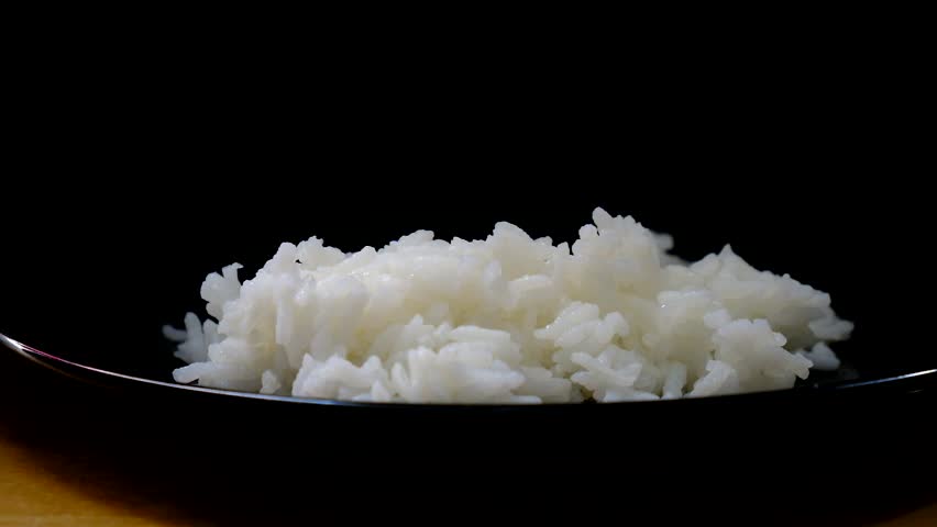 hand scooping rice on plate cooking Stock Footage Video (100% Royalty ...