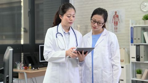 Two Female Doctors Have Discussion Standing Stock Footage Video (100% ...